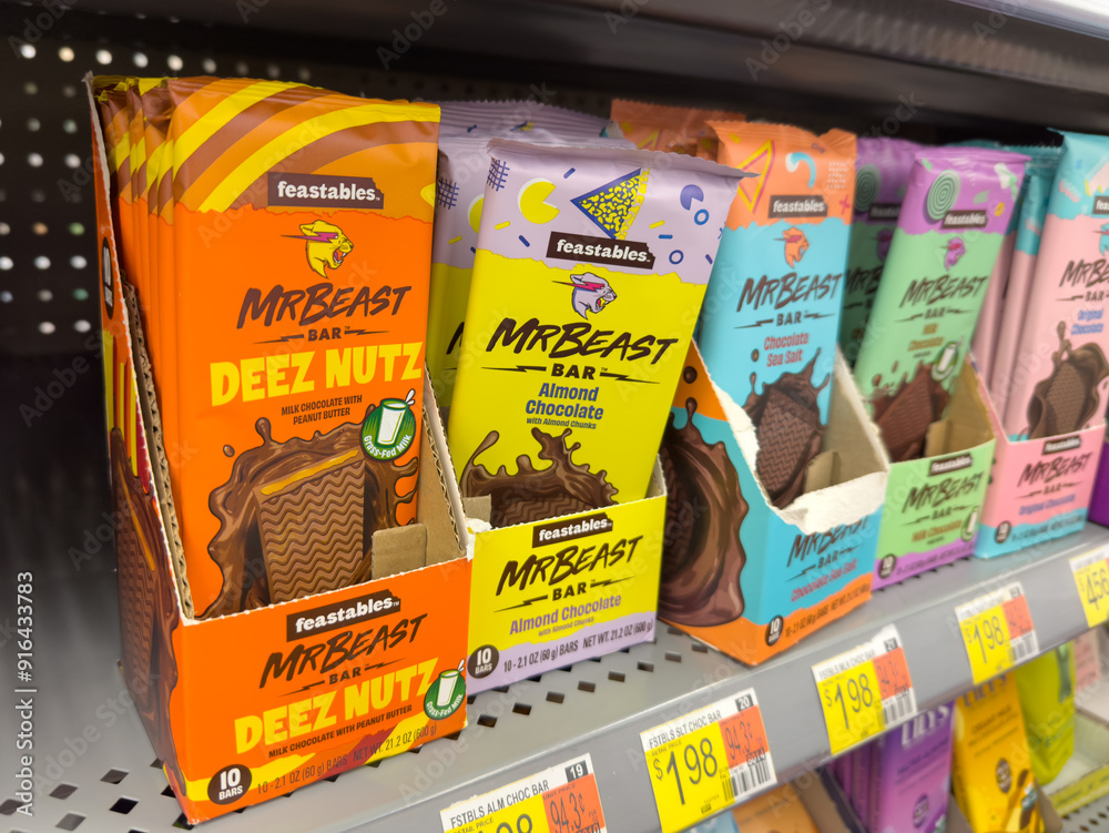 Variety of Mr. Beast Feastables chocolate bars on display. Created by ...