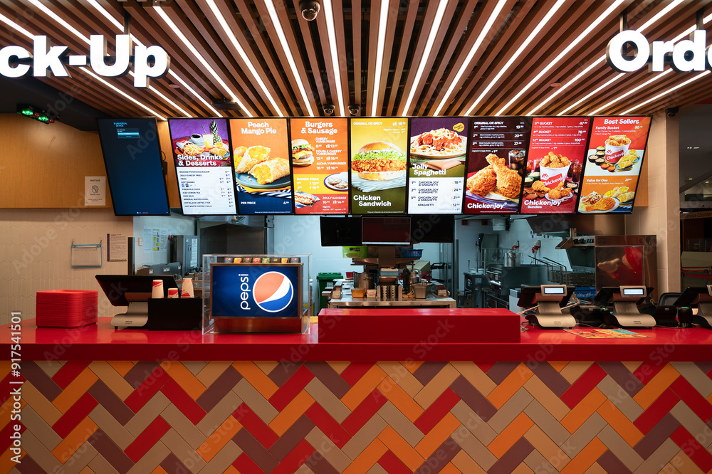KUALA LUMPUR, MALAYSIA - NOVEMBER 14, 2023: service counter in Jollibee ...
