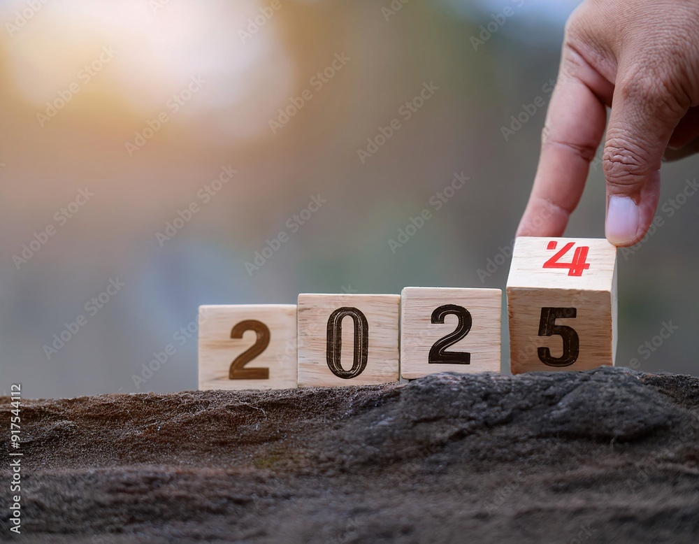 business growth in 2025 using wooden blocks. The wooden block shows the ...