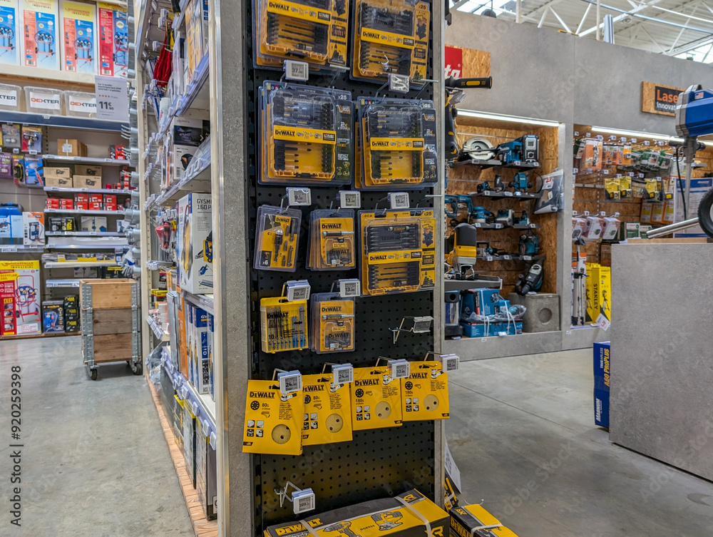 France, 13 July 2024: Aisle in hardware store with tools and ...