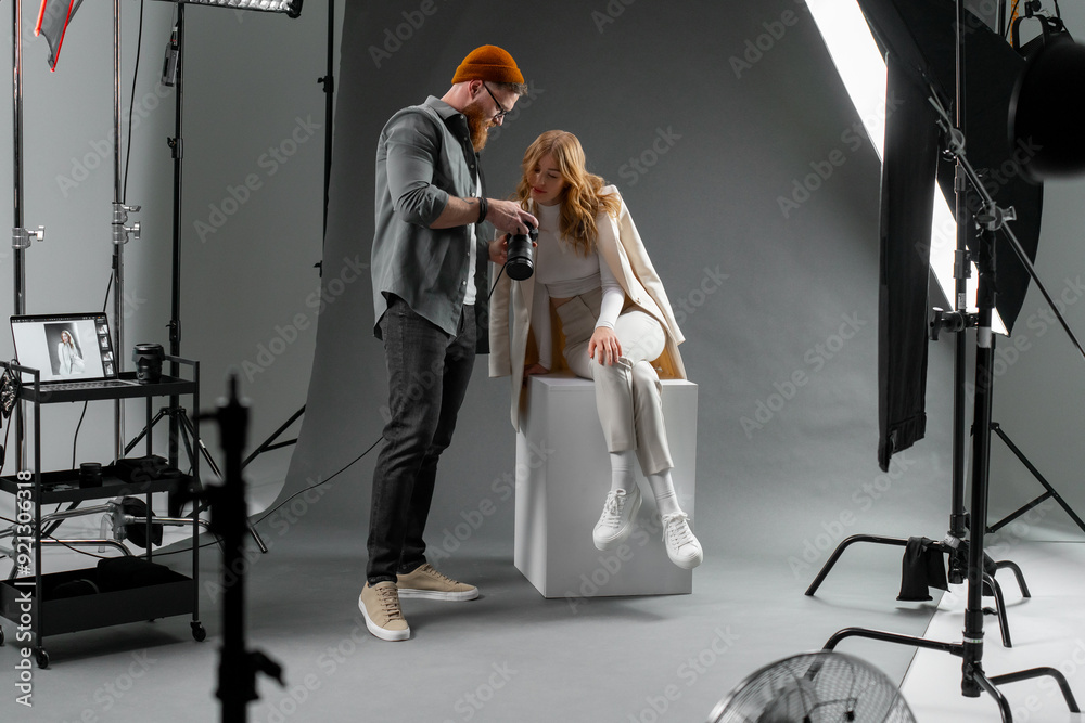 Professional studio photography session with a model and photographer ...