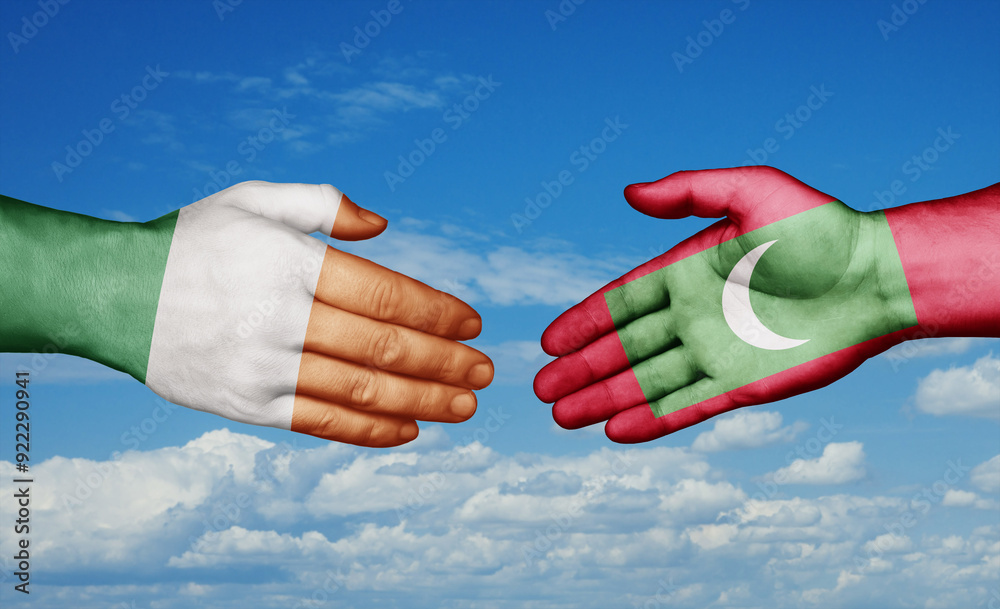 Maldives and Ireland country handshaking with flags, consensus concept ...