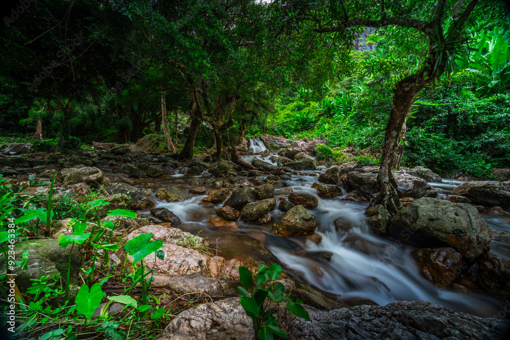 Beautiful natural Sarika waterfall with rocks in the foreground at Khao ...