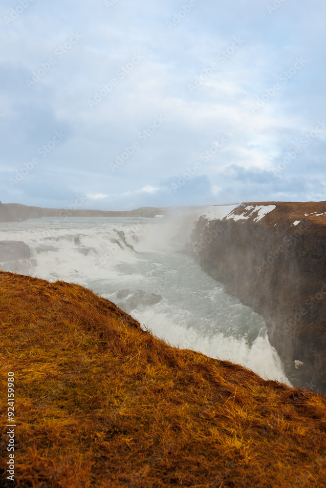 Large water flowing from hillsides and slopes in Iceland arctic Gulfoss ...