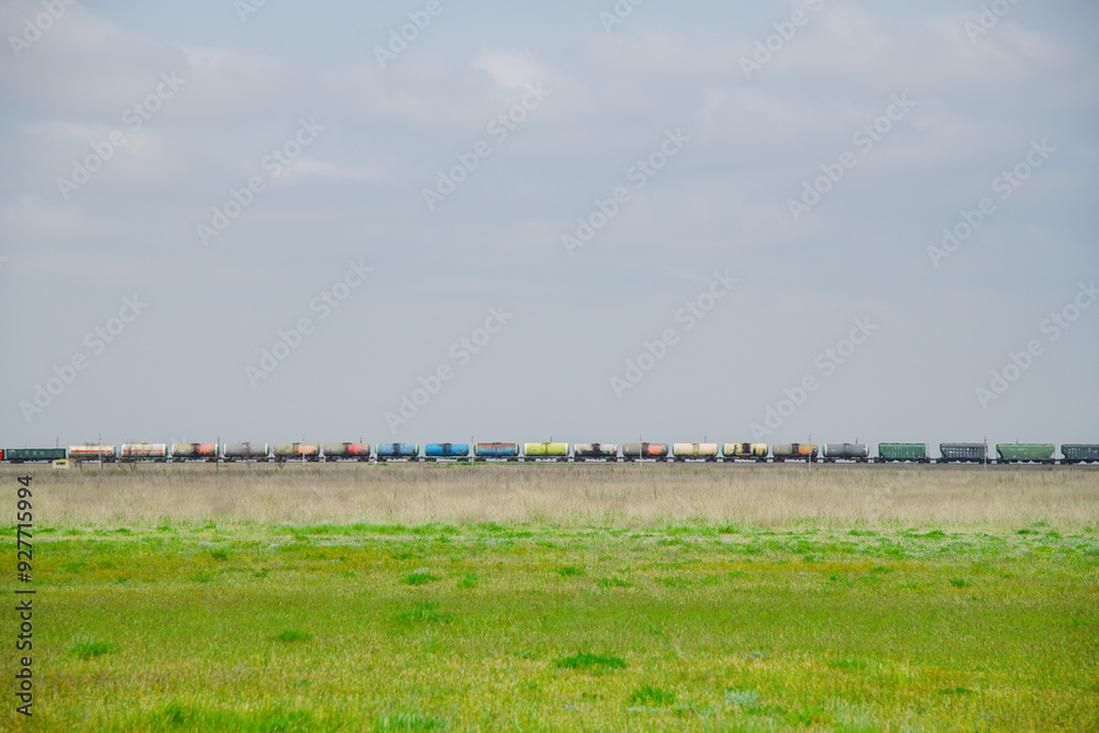 Locomotive pulls a very large and heavy freight train with wagons and ...
