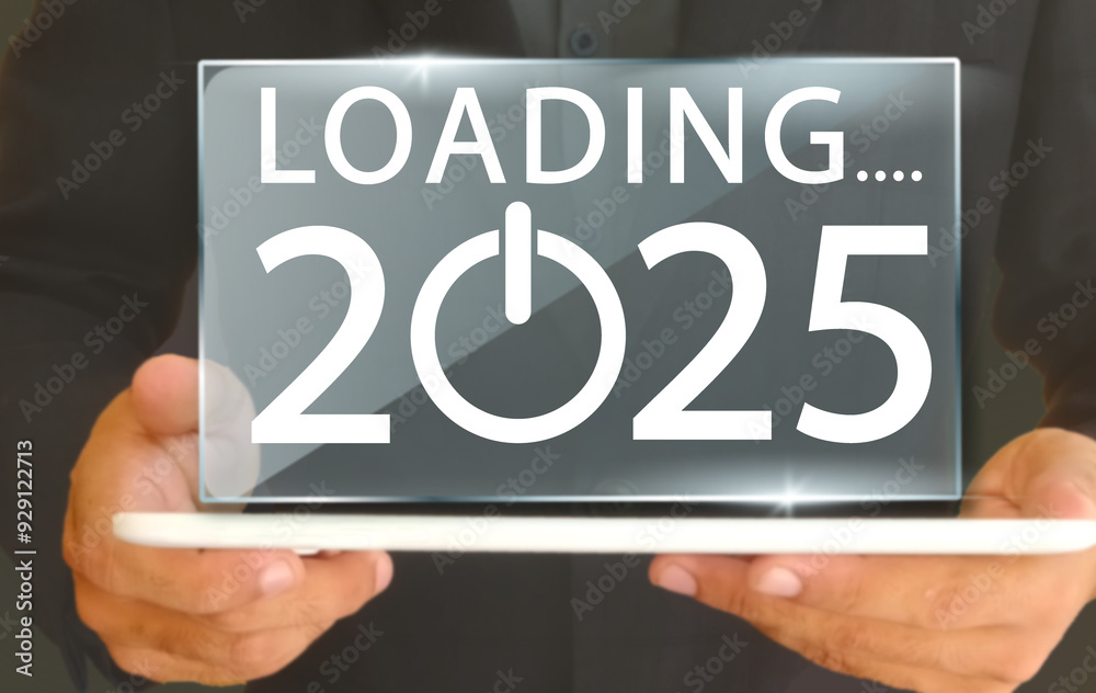 loading 2025 text on screen and tablet in hands in baground in ...