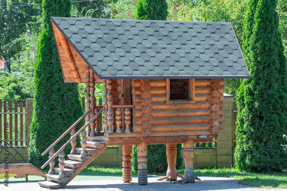 Wooden hut on chicken legs on playground. Fairytale character is house ...