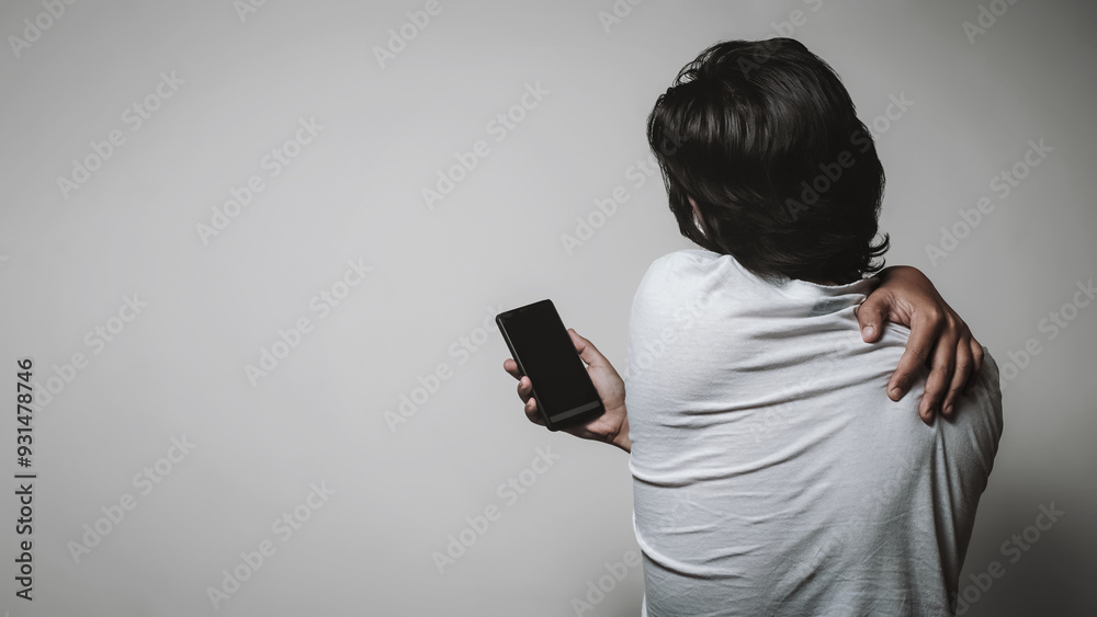 Foto de Stock Shoulder blade pain from using a mobile phone. Office ...