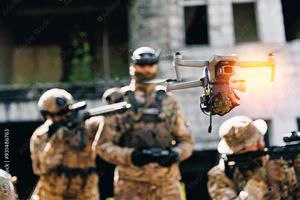 Modern army soldiers using aerial drone for artillery guidance and ...