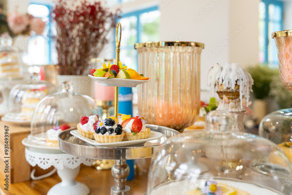 Sweet Treats Buffet: A delightful spread of colorful pastries and fruit platters, arranged on ...
