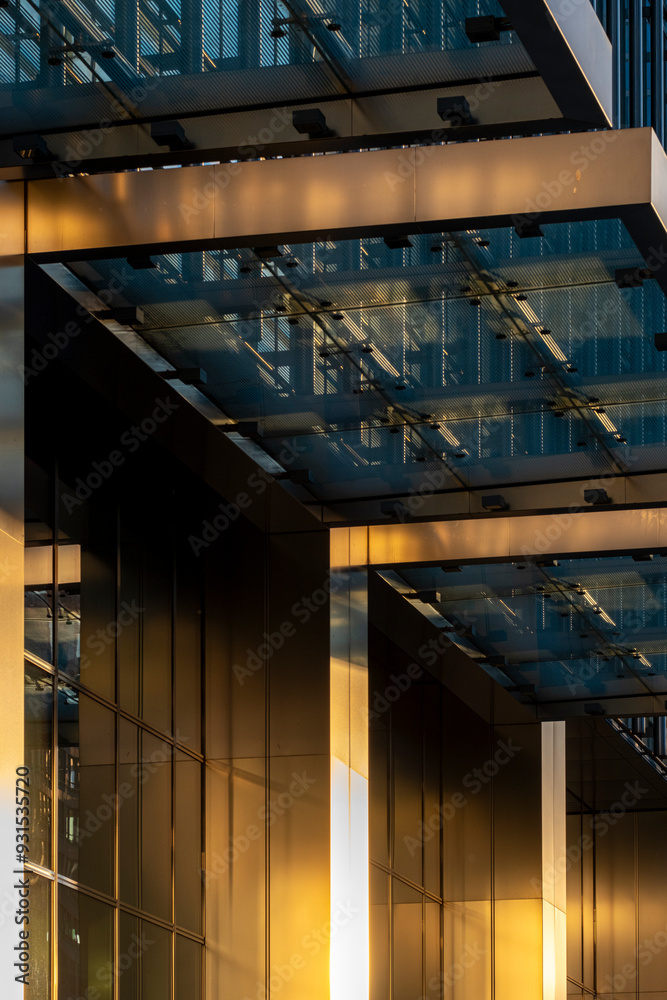 The photograph captures golden light streaming through the steel and ...