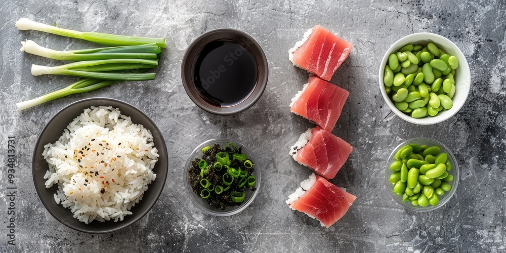 Sushi ingredients on a grey granite surface with ahi tuna rice green ...