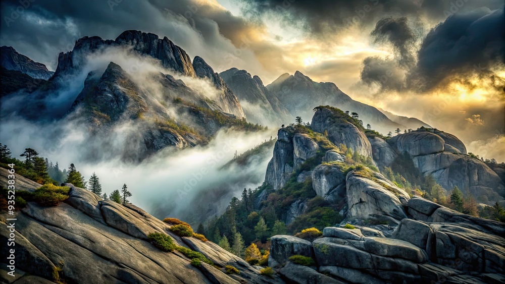 Dramatic Onyx granite mountainside landscape with misty fog and rugged ...