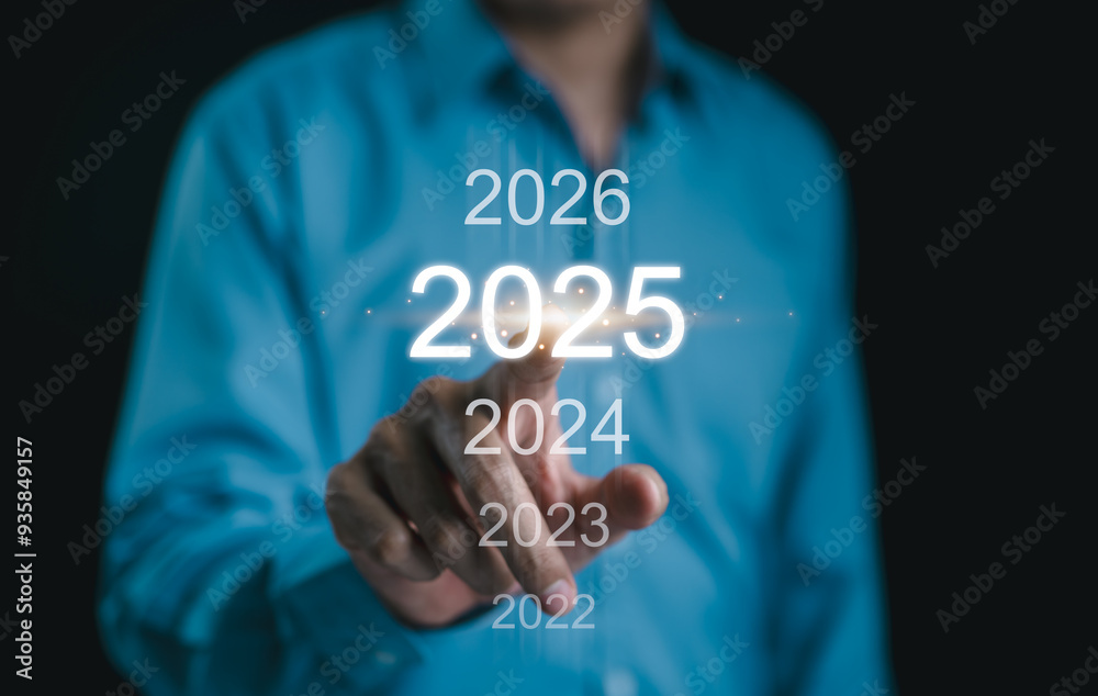 Happy New Year 2025, Businessman points toward the year 2025 on a ...
