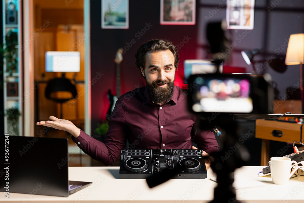 Artist filming DJ mixing tutorial using professional camera, showing ...
