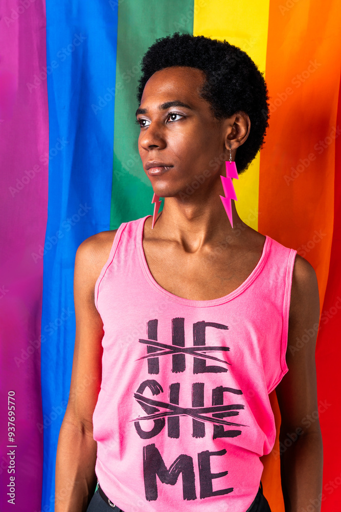 Fashionable fluid gender man wearing non binary clothing posing in ...