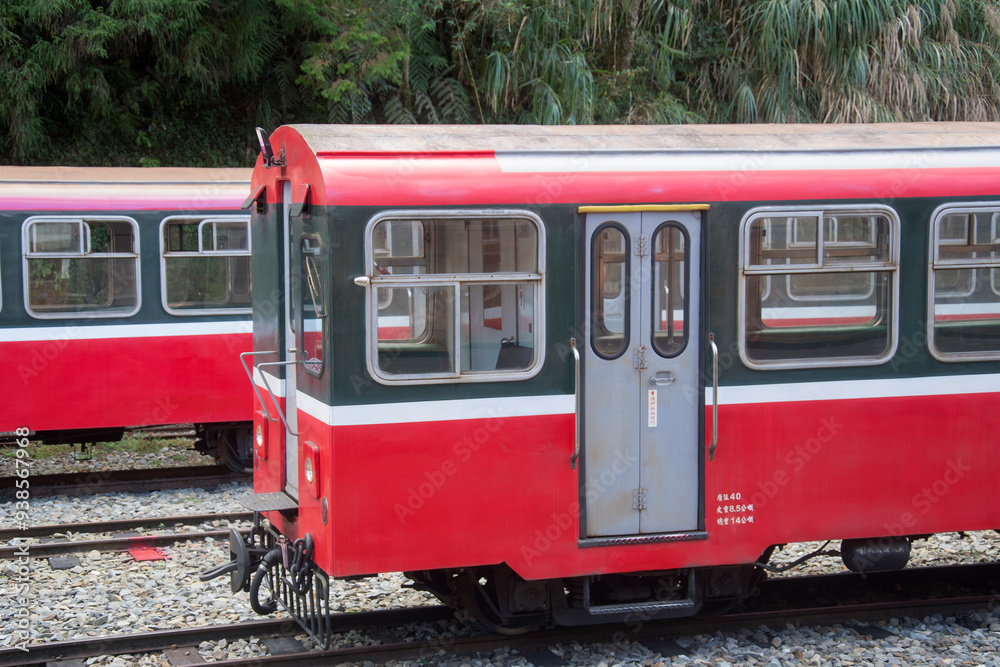Red train stop at Alishan Station in Alishan National Scenic Area ...