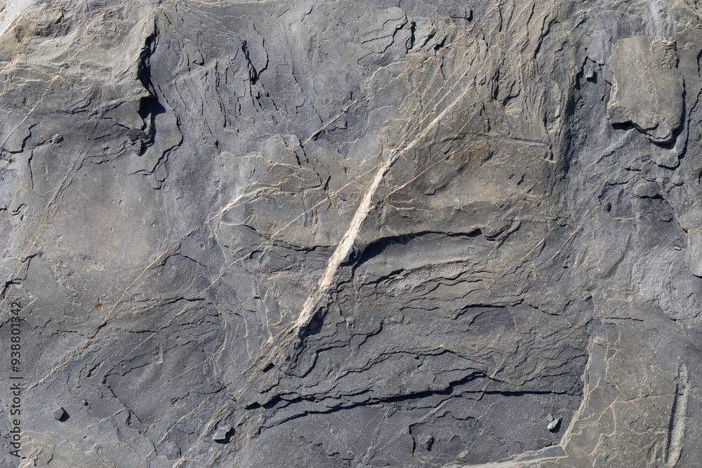 Rocks worn by wind and sea found on a wild beach, which is part of a ...