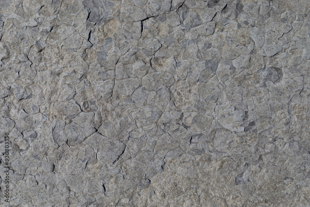 Rocks worn by wind and sea found on a wild beach, which is part of a ...