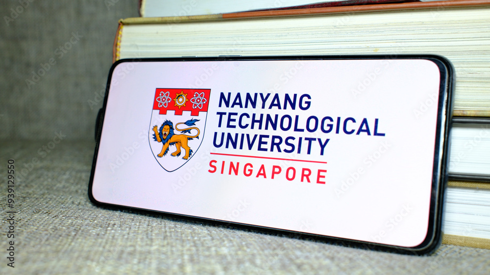 Nanyang Technological University (NTU) logo on phone screen with stack ...