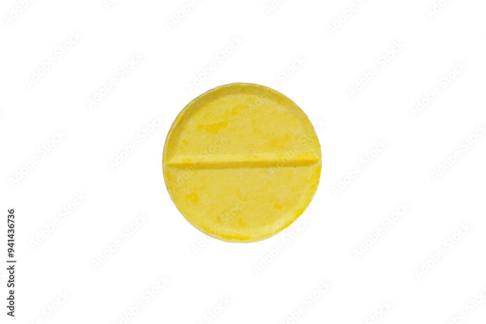 Close-up photo yellow color round pill, medicine small isolated on cut ...