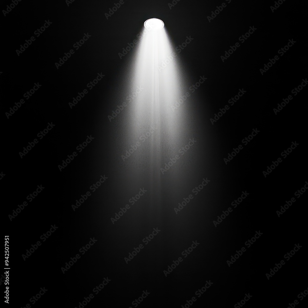 black background illuminated by a brilliant white spotlight cascading ...