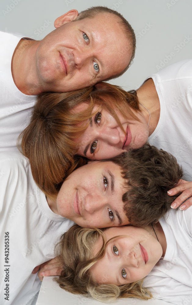 vertical portrait of family, parents and teenage boy and girl. Pyramid ...
