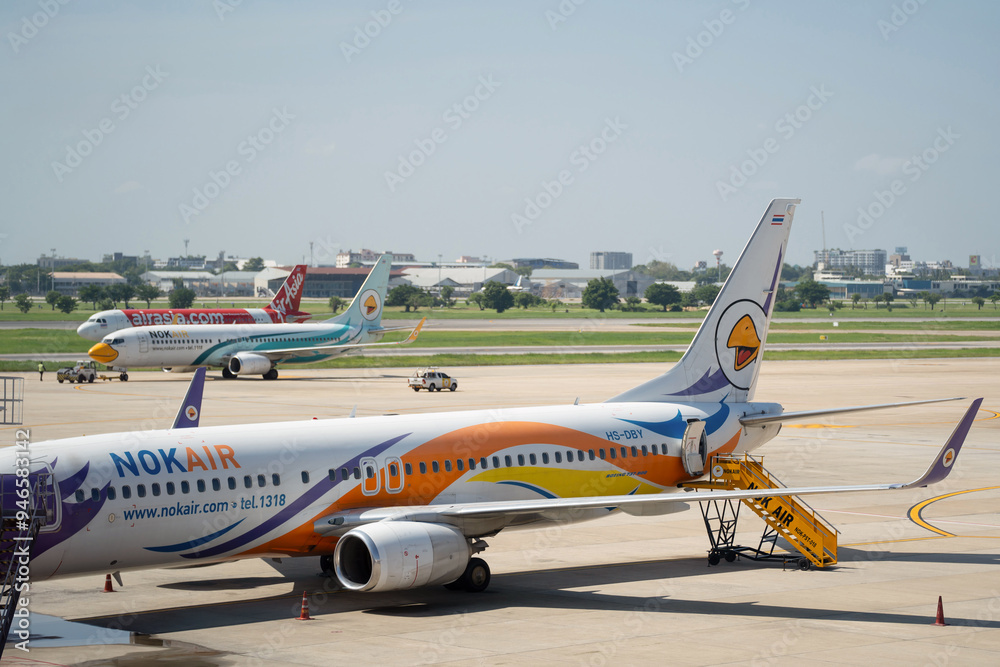 BANGKOK, THAILAND - AUGUST 18, 2023: Nok Air aircraft is connected to a ...