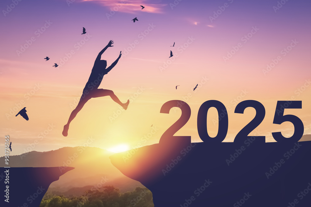 Silhouette man jumping between cliff to 2025 and birds flying at top of ...