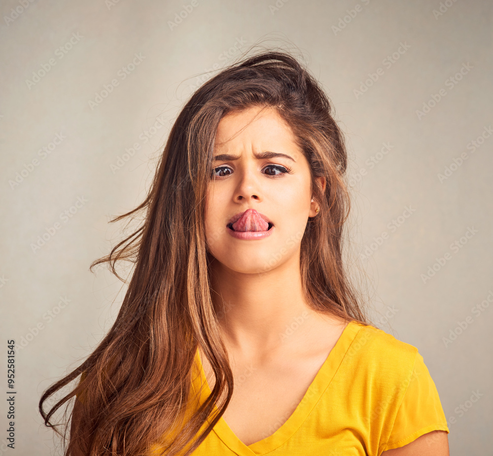 Tongue out, silly and woman in studio with emoji reaction, facial ...