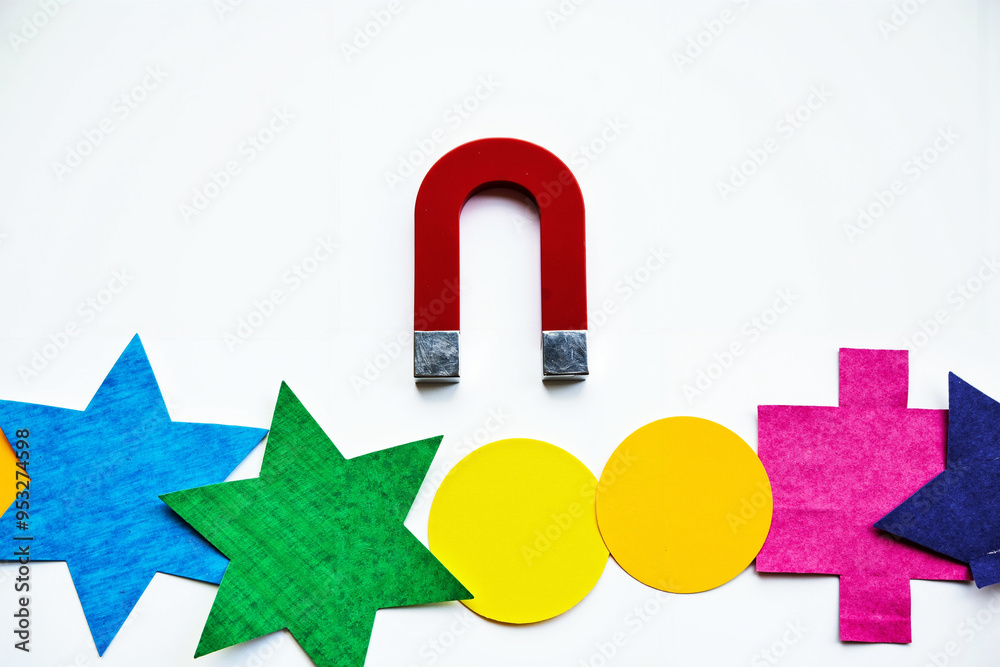 Magnetic Attraction: Red Magnet Drawing Colorful Paper Shapes - Perfect ...