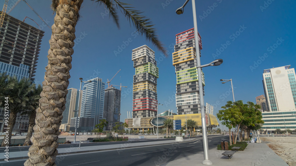 Doha skyline timelapse hyperlapse with colorful Al Marina Twin Towers ...