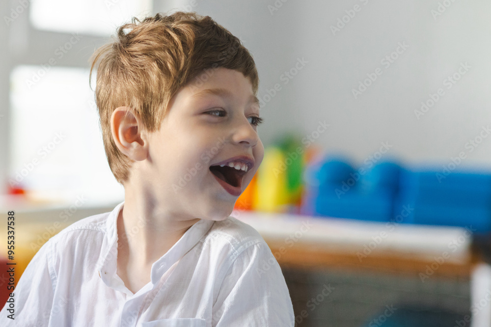 Cute male child with movement disorders smiles during a physical ...