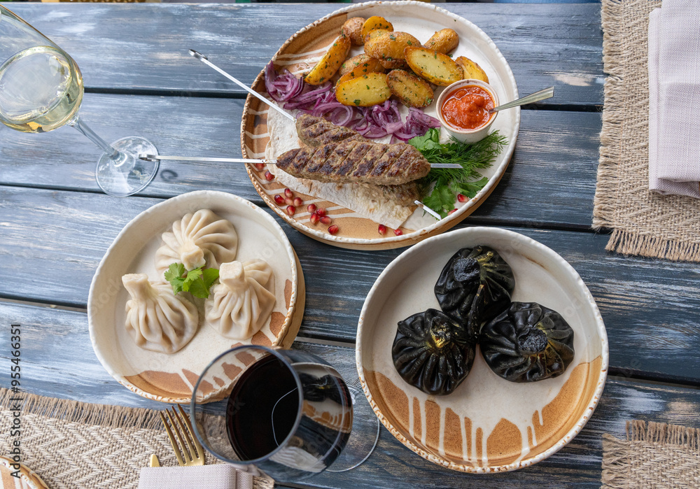 Black khinkali, Georgian seafood chinkali, spicy dumplings with minced ...