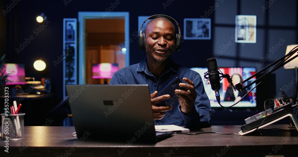 Portrait of BIPOC tech vlogger reviewing newly released smartphone in ...