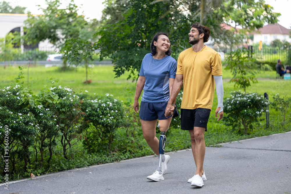 Couple with prosthetic leg from amputation walking exercise in the ...