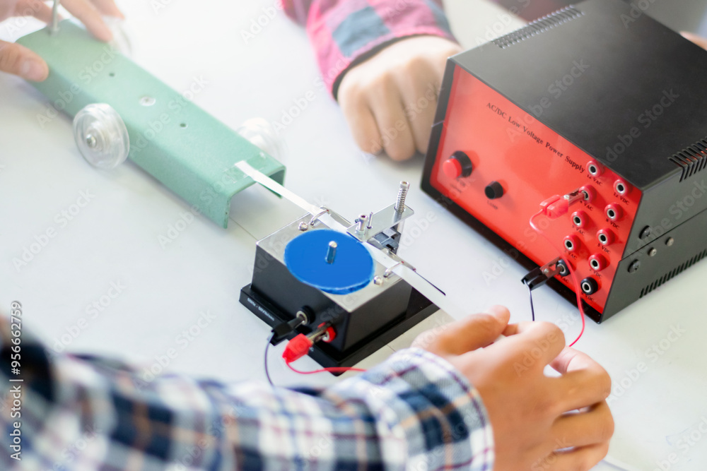 Children are studying the measurement of friction force with a spring ...