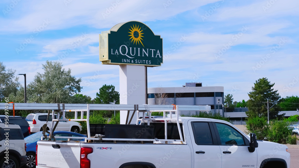 La Quinta cahin hotel entrance stand with the brand's logo sign with a ...