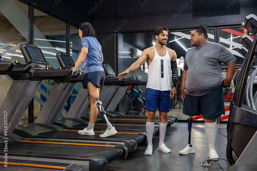 Gym trainer is giving advice to overweight man with prosthetic leg from ...