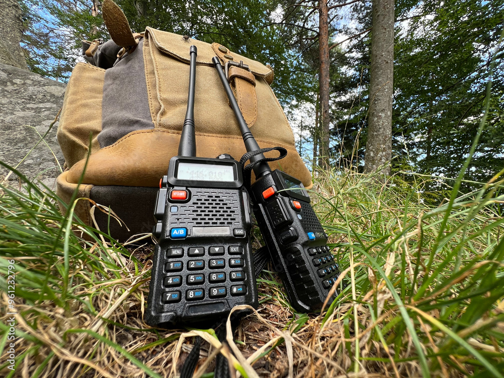 Walkie talkies near backpack. Concept of wireless communications. Off ...