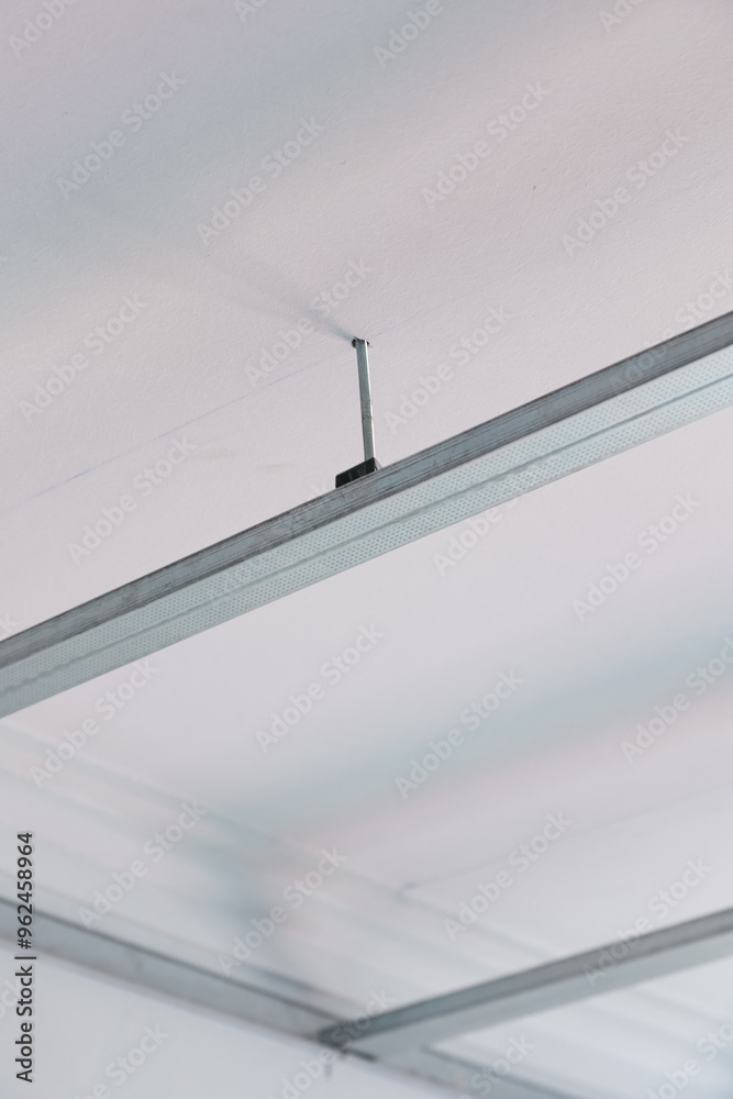 Close-up of a suspended ceiling installation with visible metal ...
