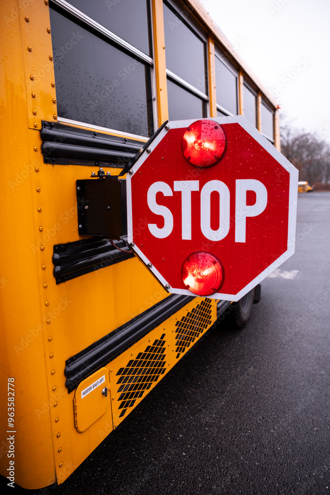 School bus stop sign Flashing Stock Photo | Adobe Stock