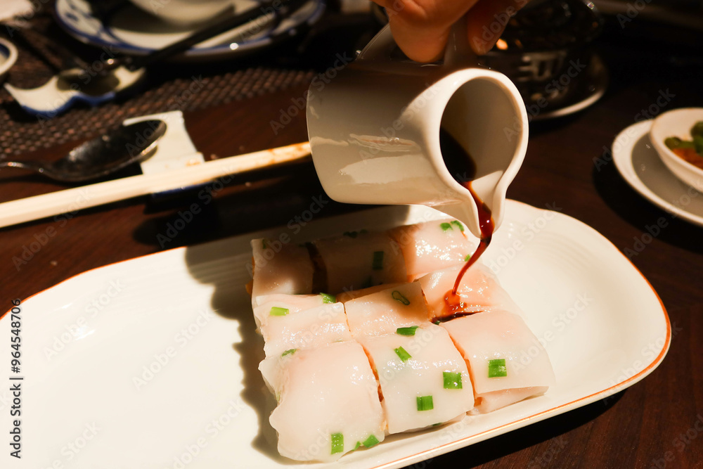 close up of Cantonese Hong Kong dim sum steamed rice roll with shrimp ...