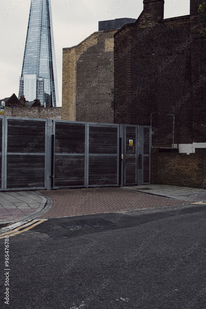 The photo captures a street view dominated by The Shard skyscraper in ...
