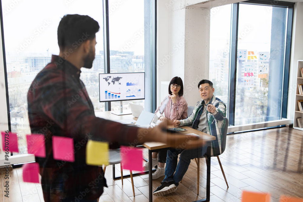 Group of colleagues conducting brainstorming session in modern office ...