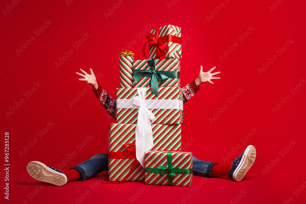 Full size photo of cute little boy hide behind present pile celebrate ...