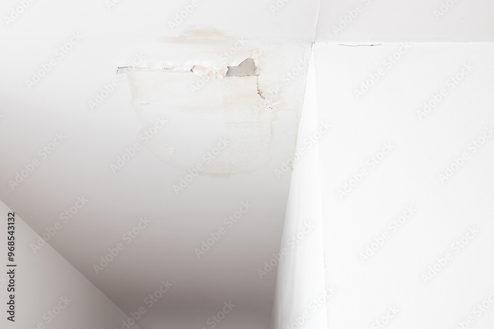 Damage to the ceiling surface of the room at home,dirty water stains ...