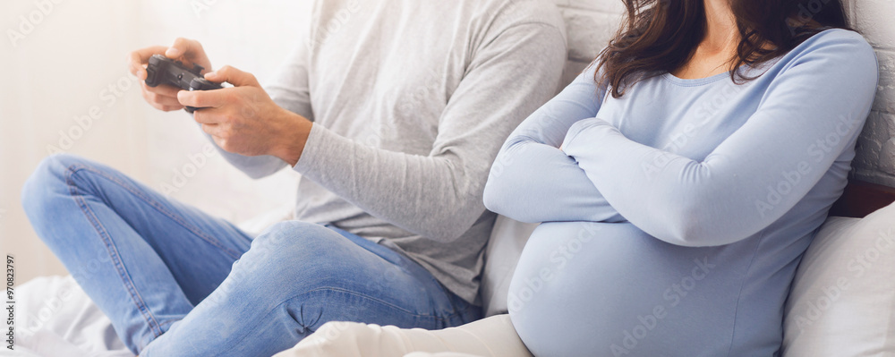 Pregnant woman angry to her husband playing video games with joystick ...