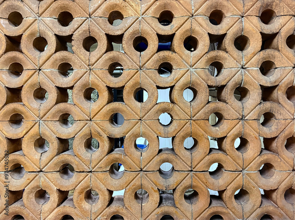 Floral pattern of clay honed breeze block or roster. Breeze block is ...