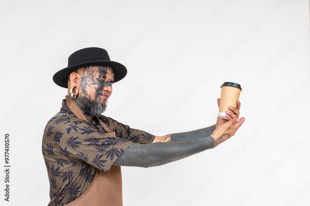 Side view of a unique looking barista handing over takeaway coffee ...
